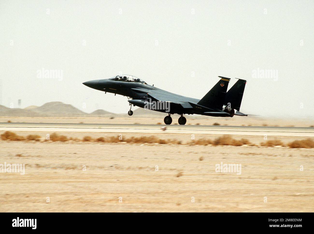 A 336th Tactical Fighter Squadron F-15E Eagle aircraft takes off on a ...