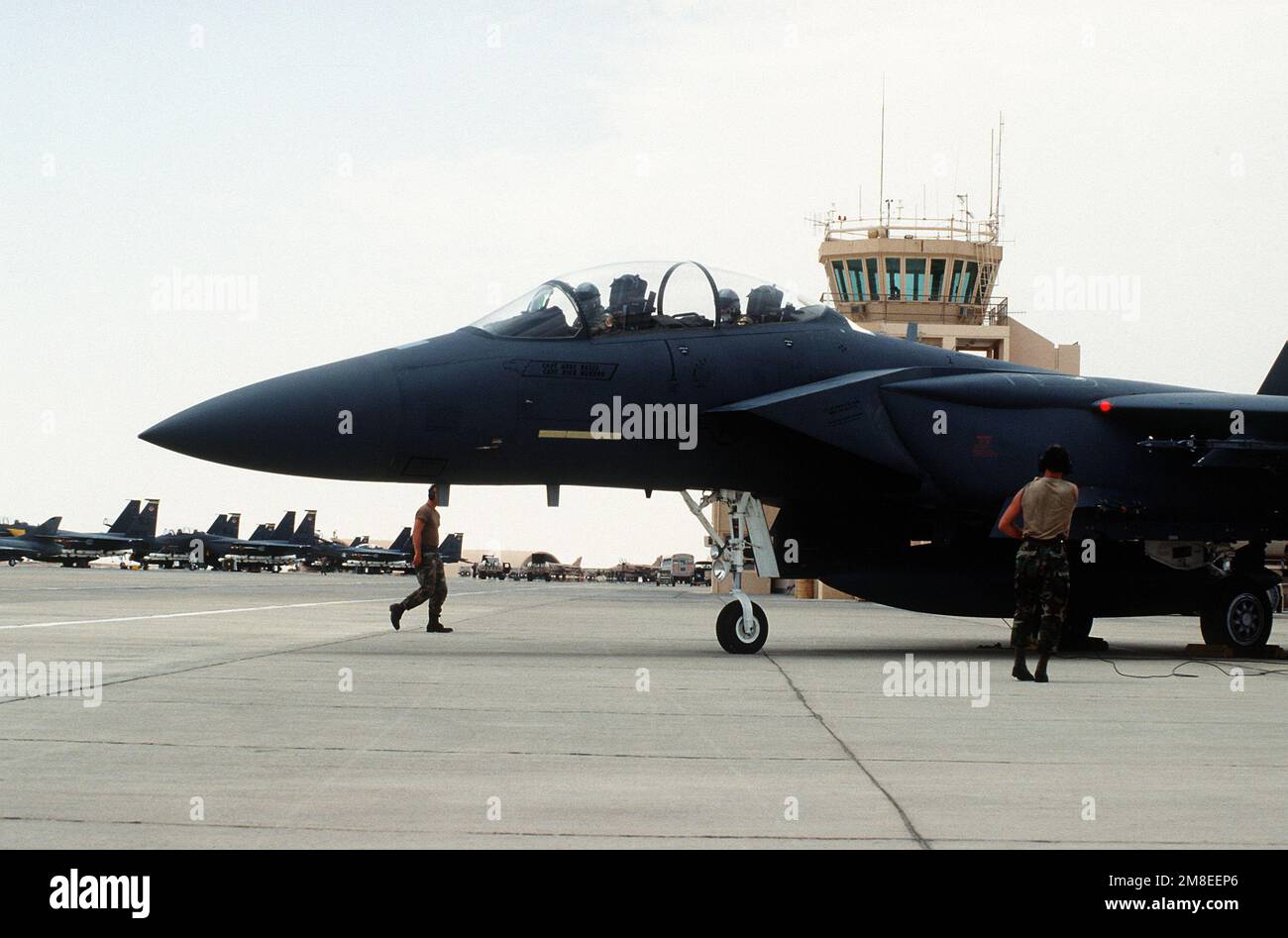 A ground crew member communicates with the pilot of a 4th Tactical ...