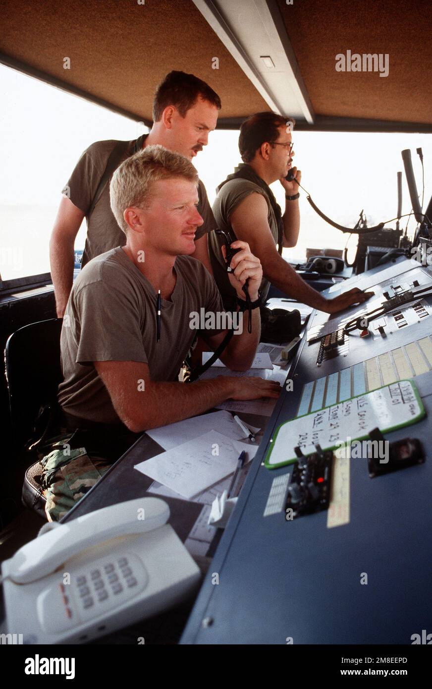 Air traffic controllers works in a portable control tower during ...