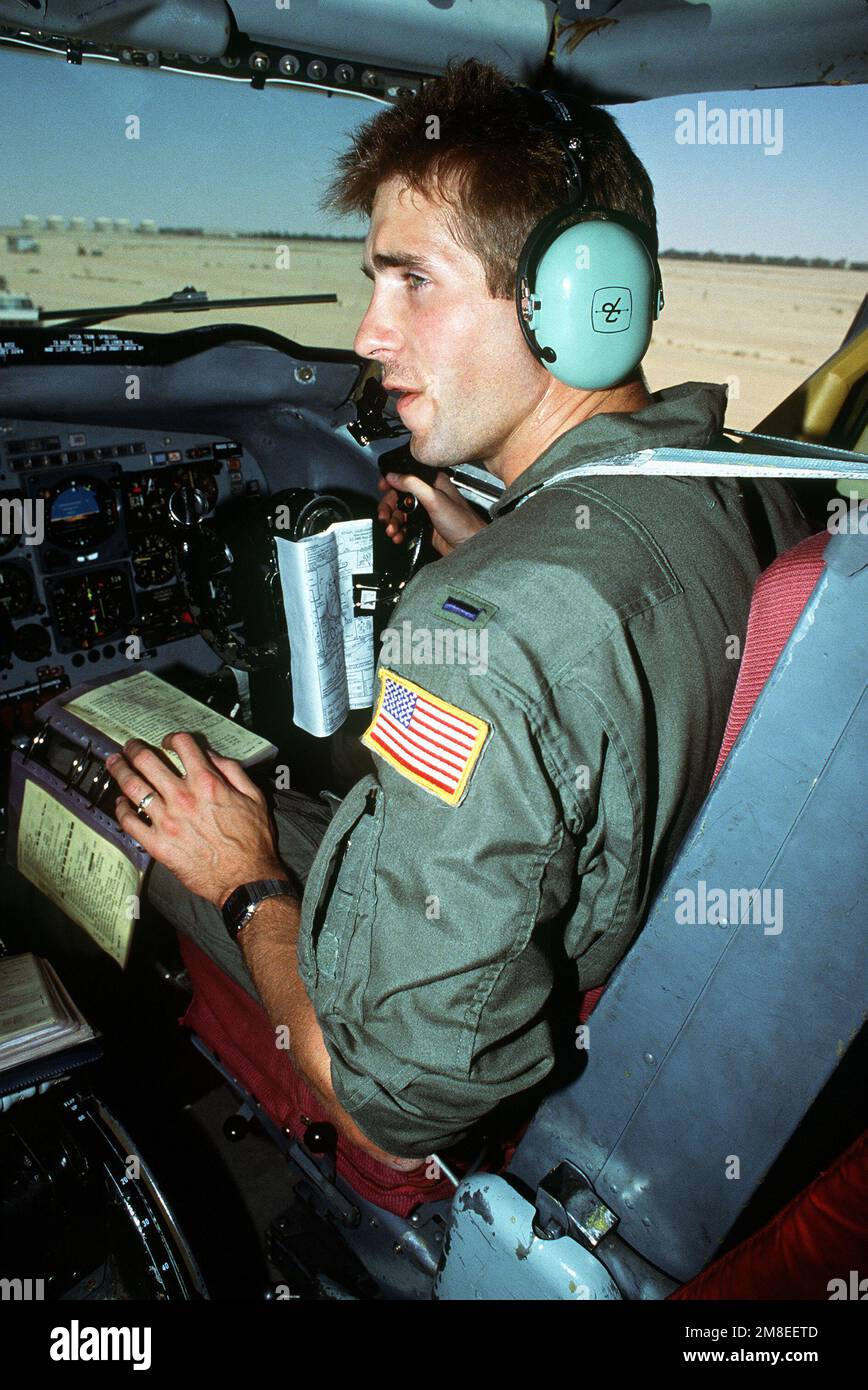 The co-pilot of a KC-135 Stratotanker aircraft helps run through the ...