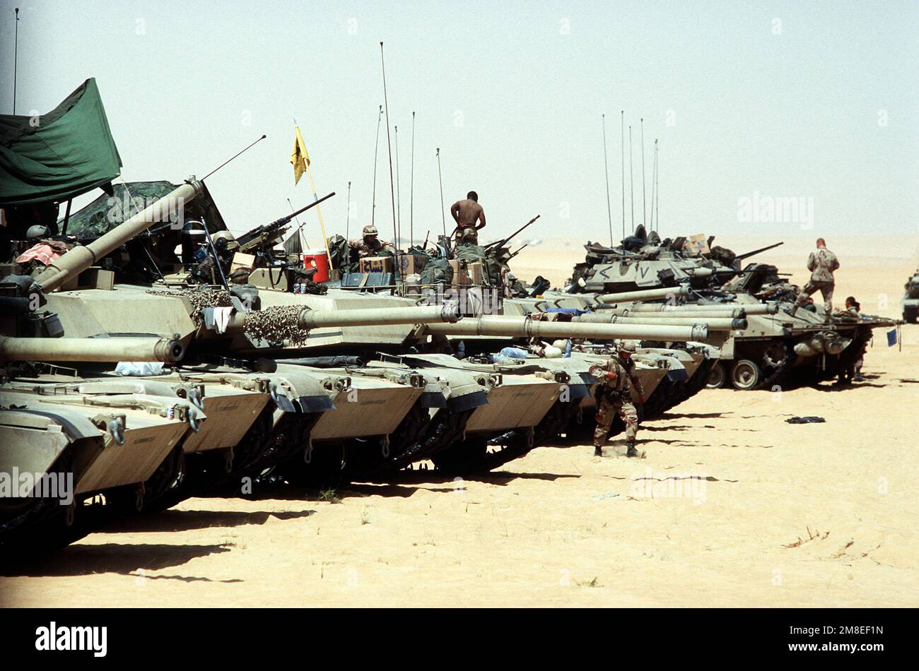 Soldiers of the 24th Infantry Division (Mechanized) pack their gear ...