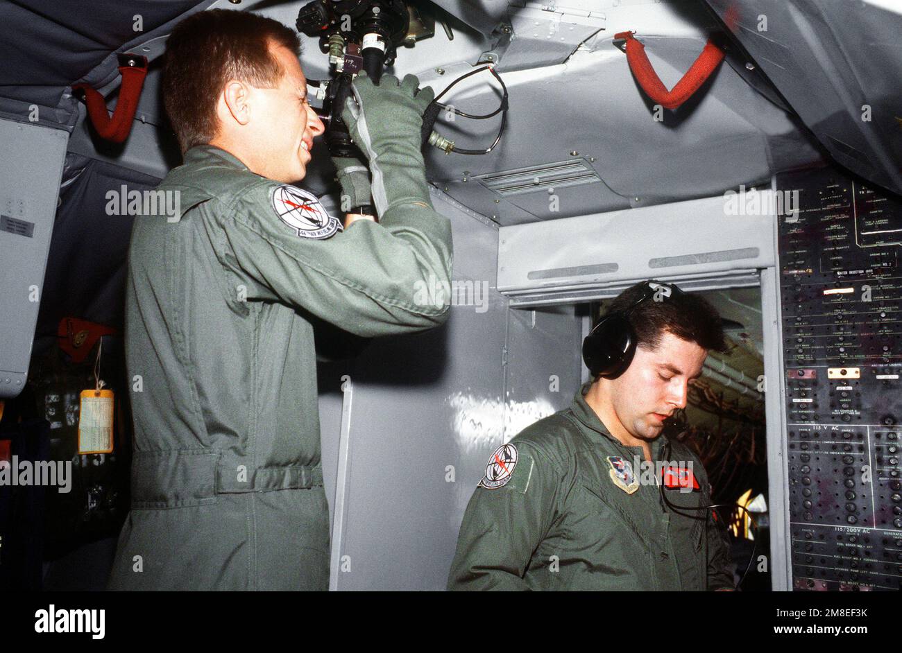 CAPT. Philip P. Nardiga, left, a KC-135 Stratotanker aircraft navigator ...