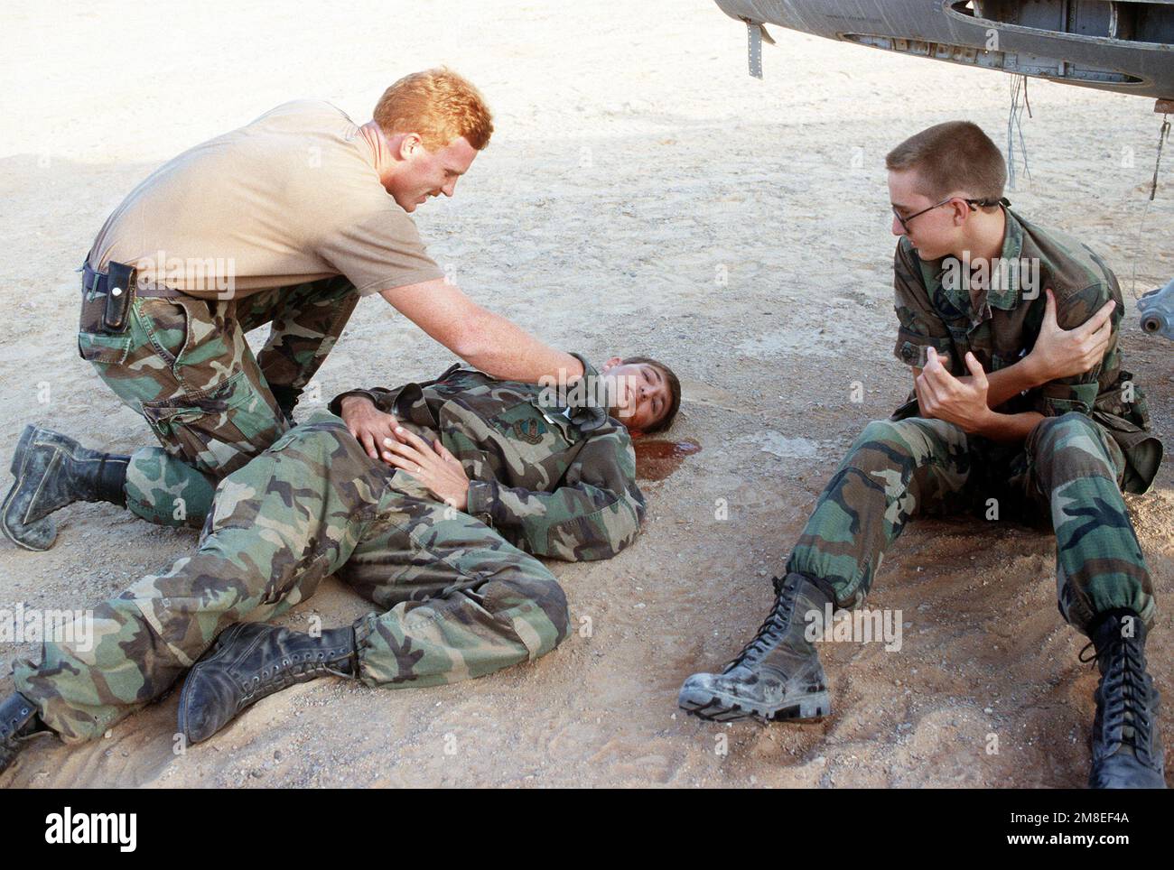A member of the 4th Medical Group examines STAFF SGT. Robert Lee ...