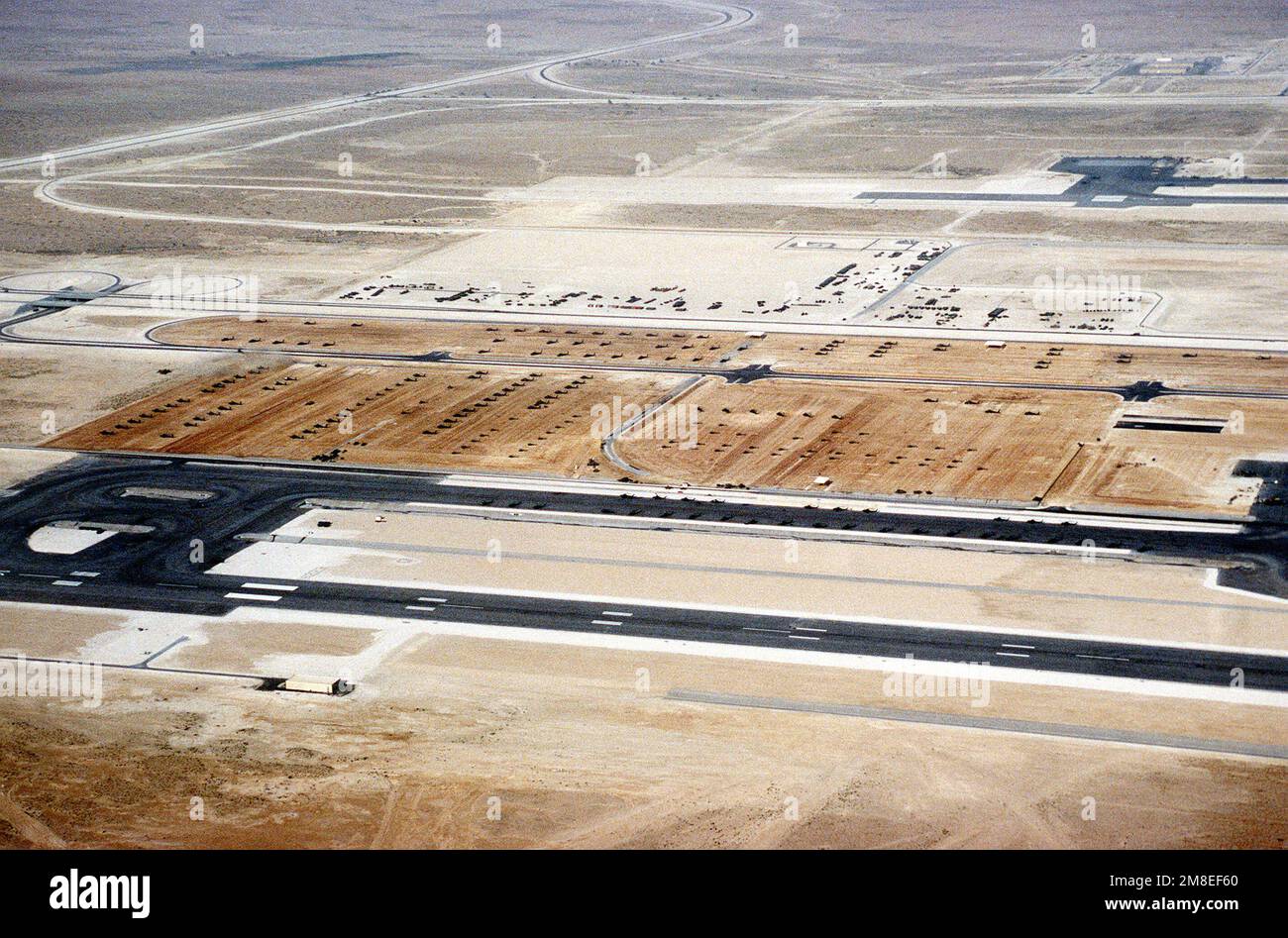 An aerial view of a portion of an air base during Operation Desert ...