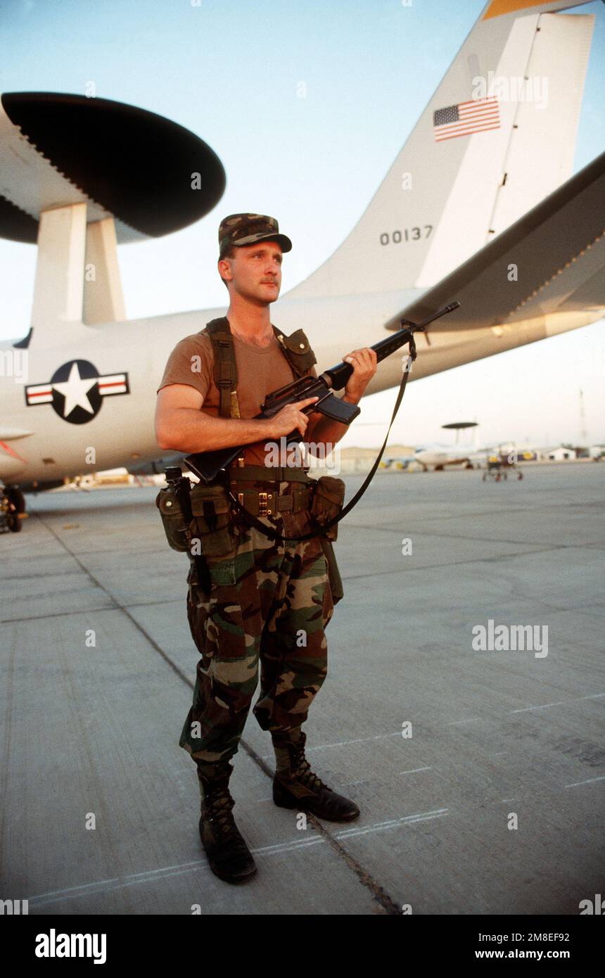 SGT. Russel C. Jones, 437th Security Police Squadron, guards an E-3 ...