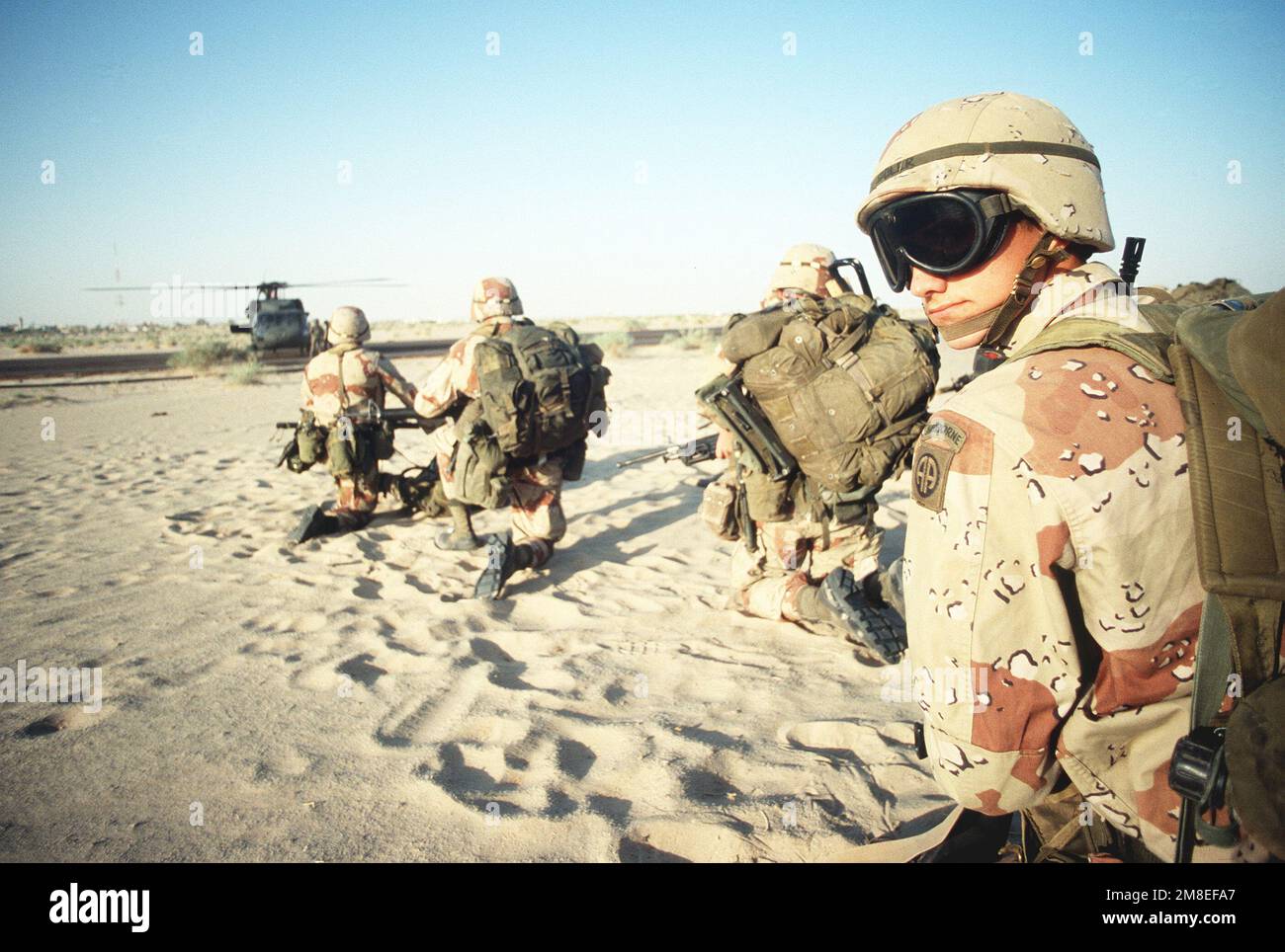 Soldiers from the 82nd Airborne Division wait for the signal to board a ...