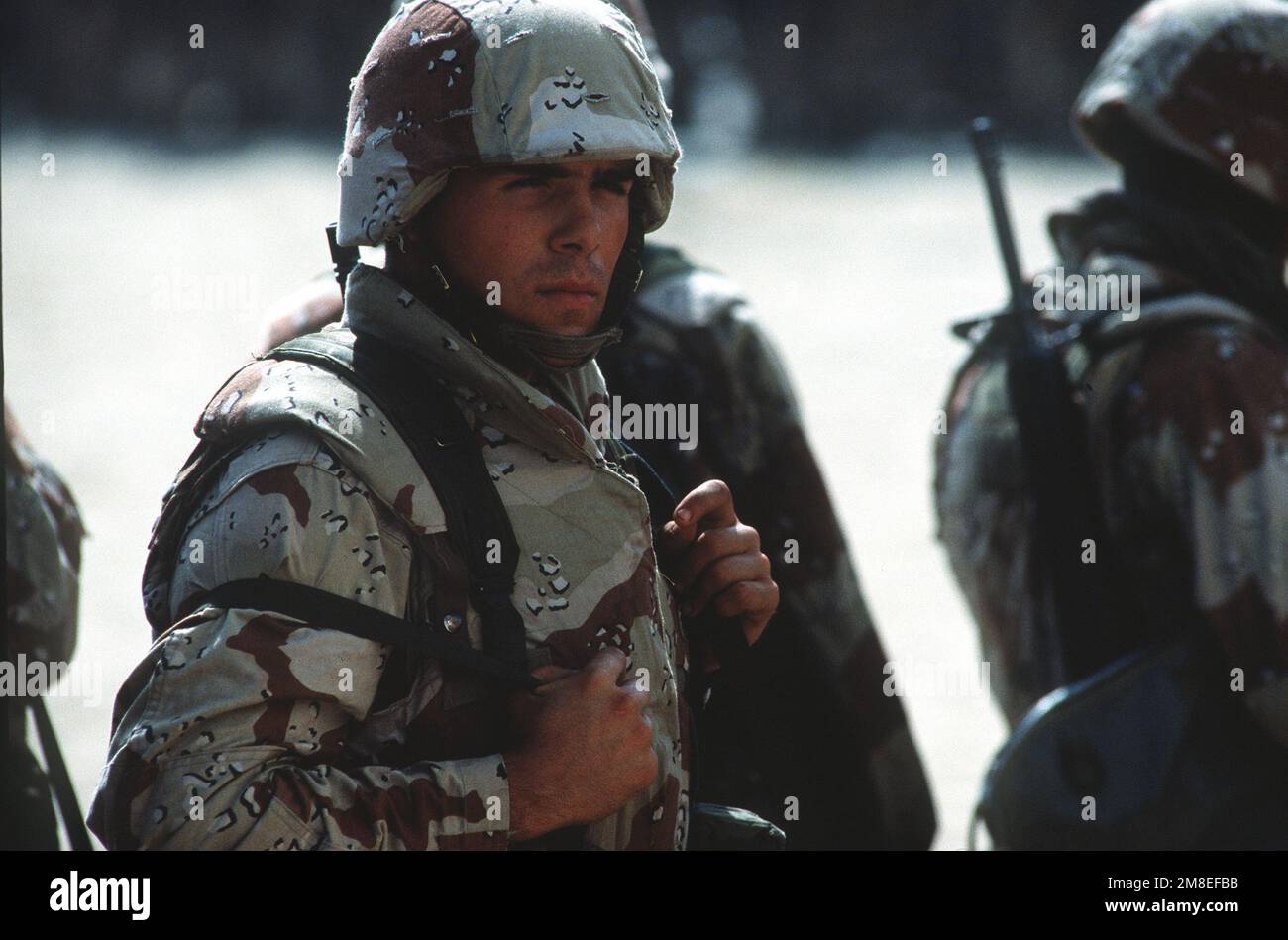 A Marine moves out with his unit during Operation Desert Shield ...