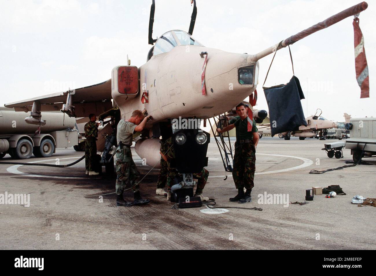 British and U.S. Air Force ground crew members refuel a Royal Air Force ...