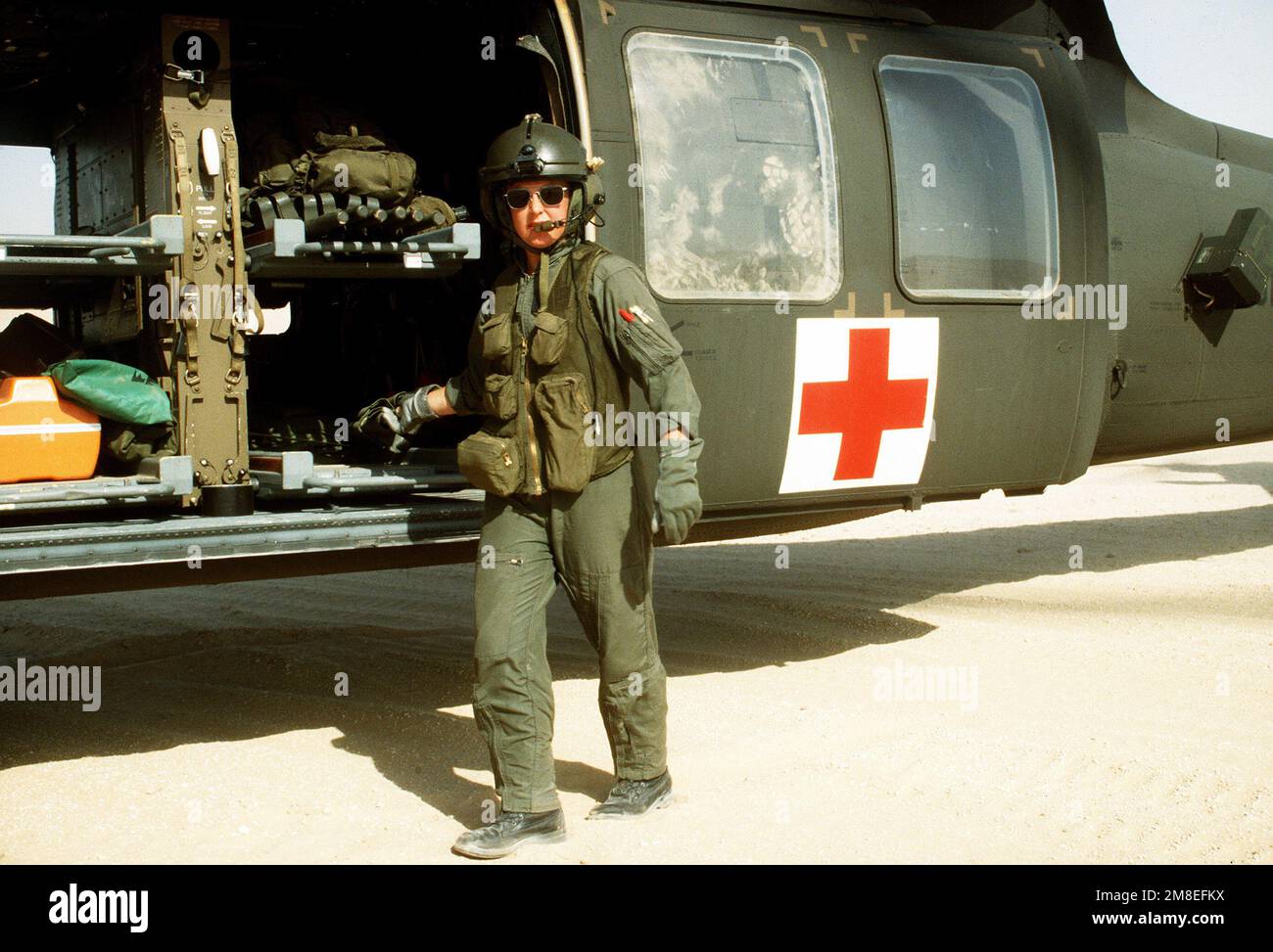 The crew chief of a 45th Medical Company UH-60A Black Hawk (Blackhawk ...