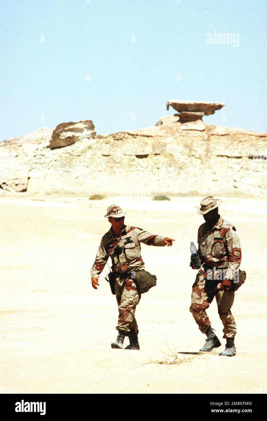Members of the 14th Infantry Division converse as they walk near their ...