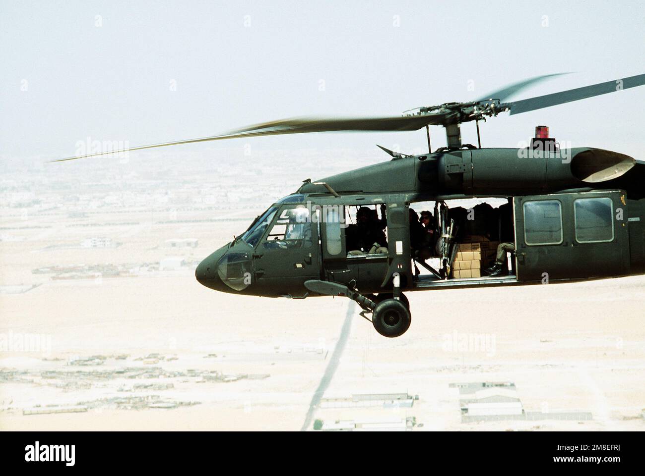 A UH-60 Black Hawk (Blackhawk) helicopter transports troops and ...