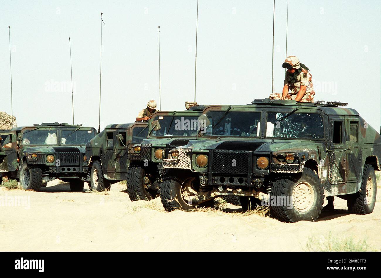 M998 High-Mobility Multipurpose Wheeled Vehicles (HMMWV) are parked in ...