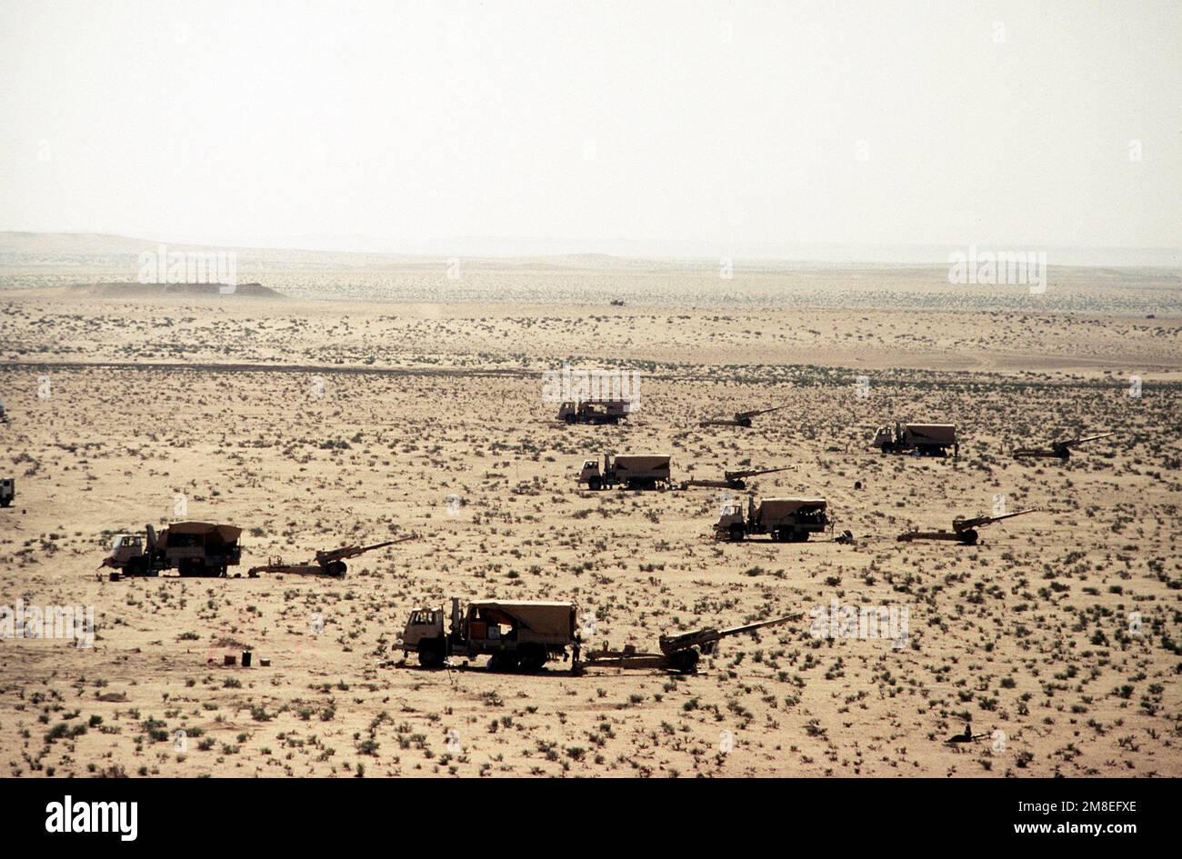 Steyr vehicles stand near FH-70 155mm towed howitzers after ...