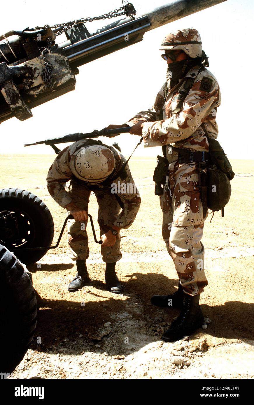 A member of Btry. C, 1ST Bn., 319th Field Artillery Regt., holds an M ...