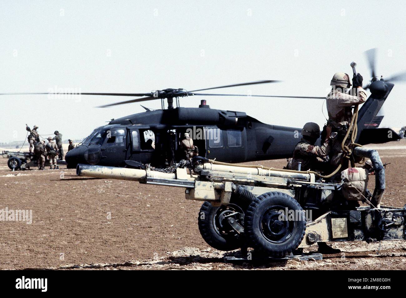 Members of Btry. C, 1ST Bn., 319th Field Artillery Regt., prepare an M ...
