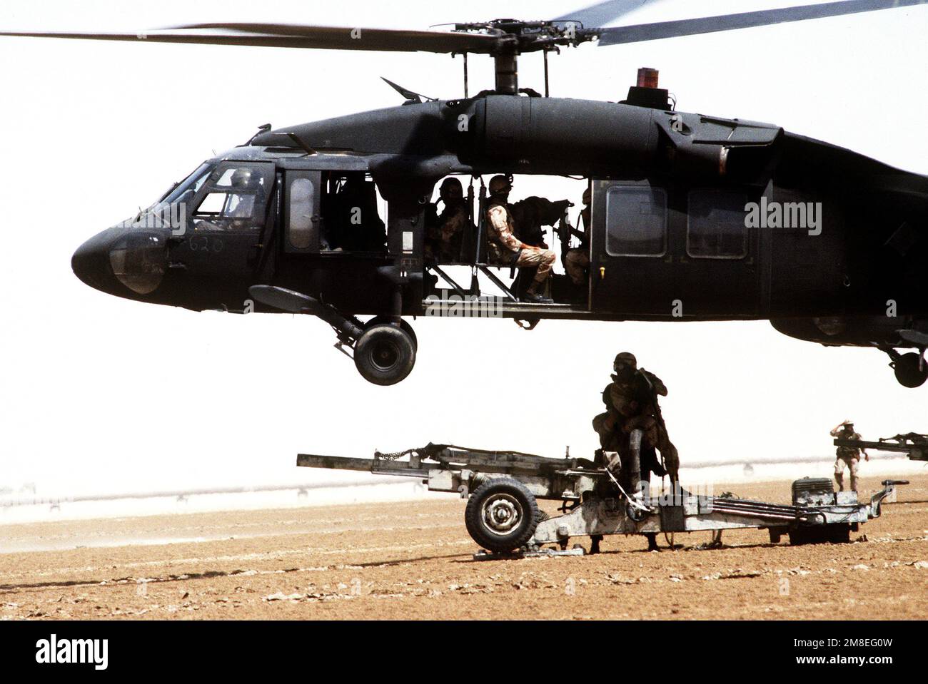 A member of Btry. C, 1ST Bn., 319th Field Artillery Regt., prepares to ...