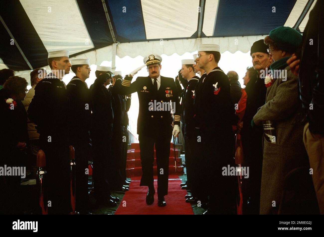 CAPT Joseph J. Krol Jr., commander, Submarine Squadron 8, salutes as he ...