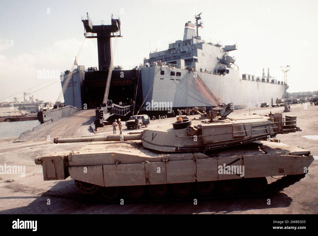An M-1 Abrams main battle tank stands on the pier after being offloaded ...