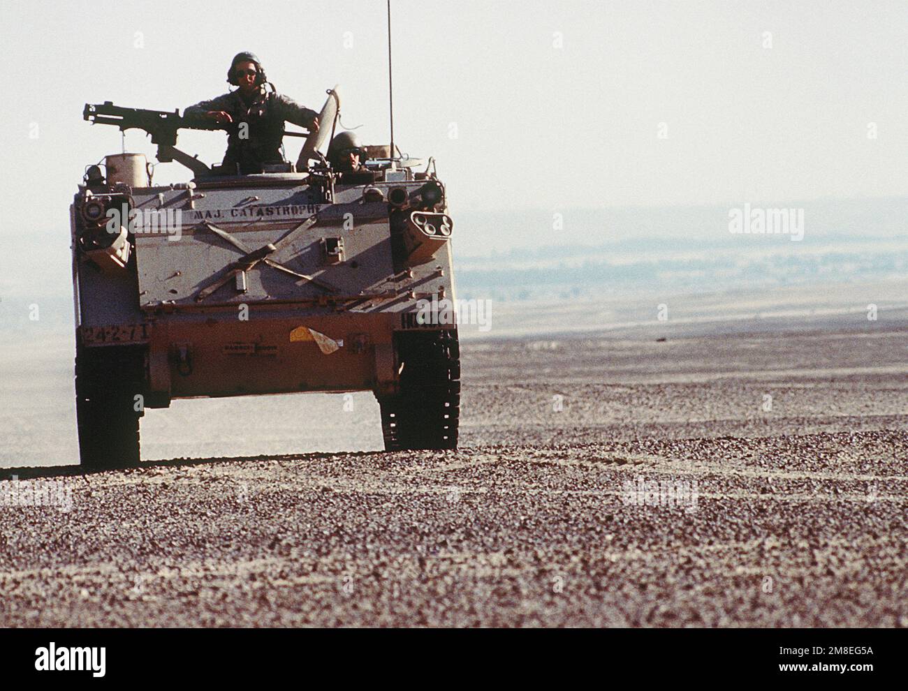 An M-113 armored personnel carrier moves along the desert during ...