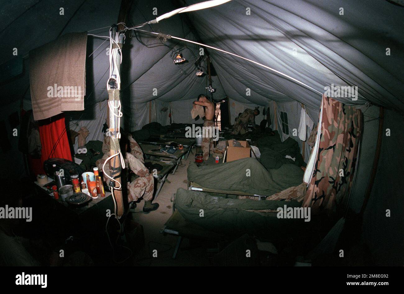 Enlisted G-3 personnel relax in their tent at the 2nd Marine Division ...