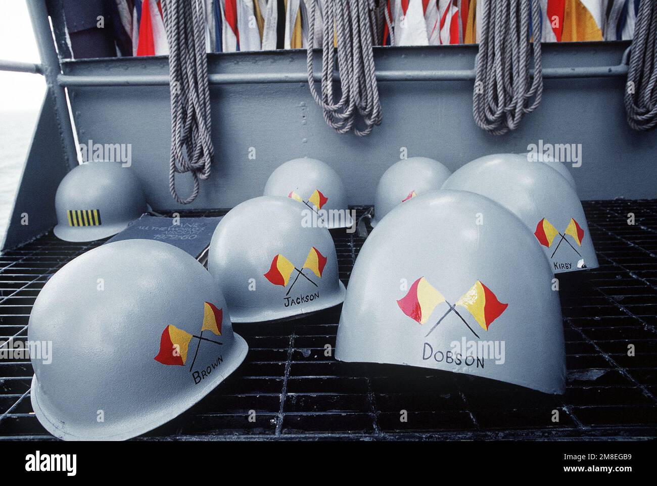 The personalized helmets of several signalmen lie beside the rag bag on ...