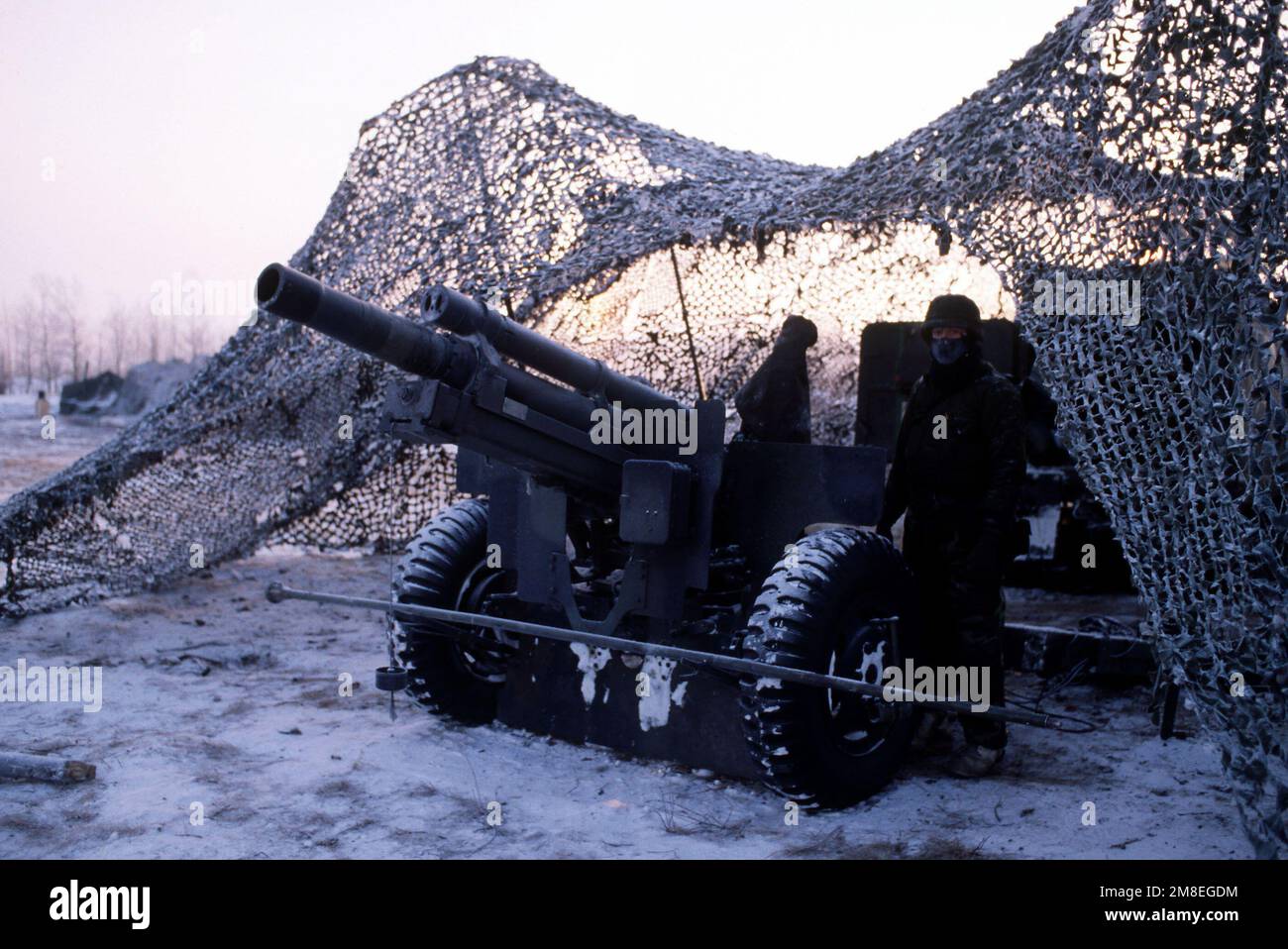 A gun team from Btry. B, 5th Bn., 11th Field Artillery, prepares an M ...
