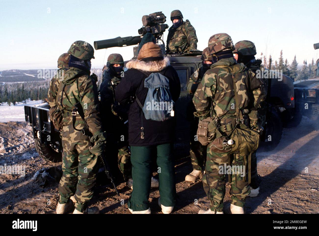A reporter talks with soldiers from the 6th Infantry Division (Llight ...