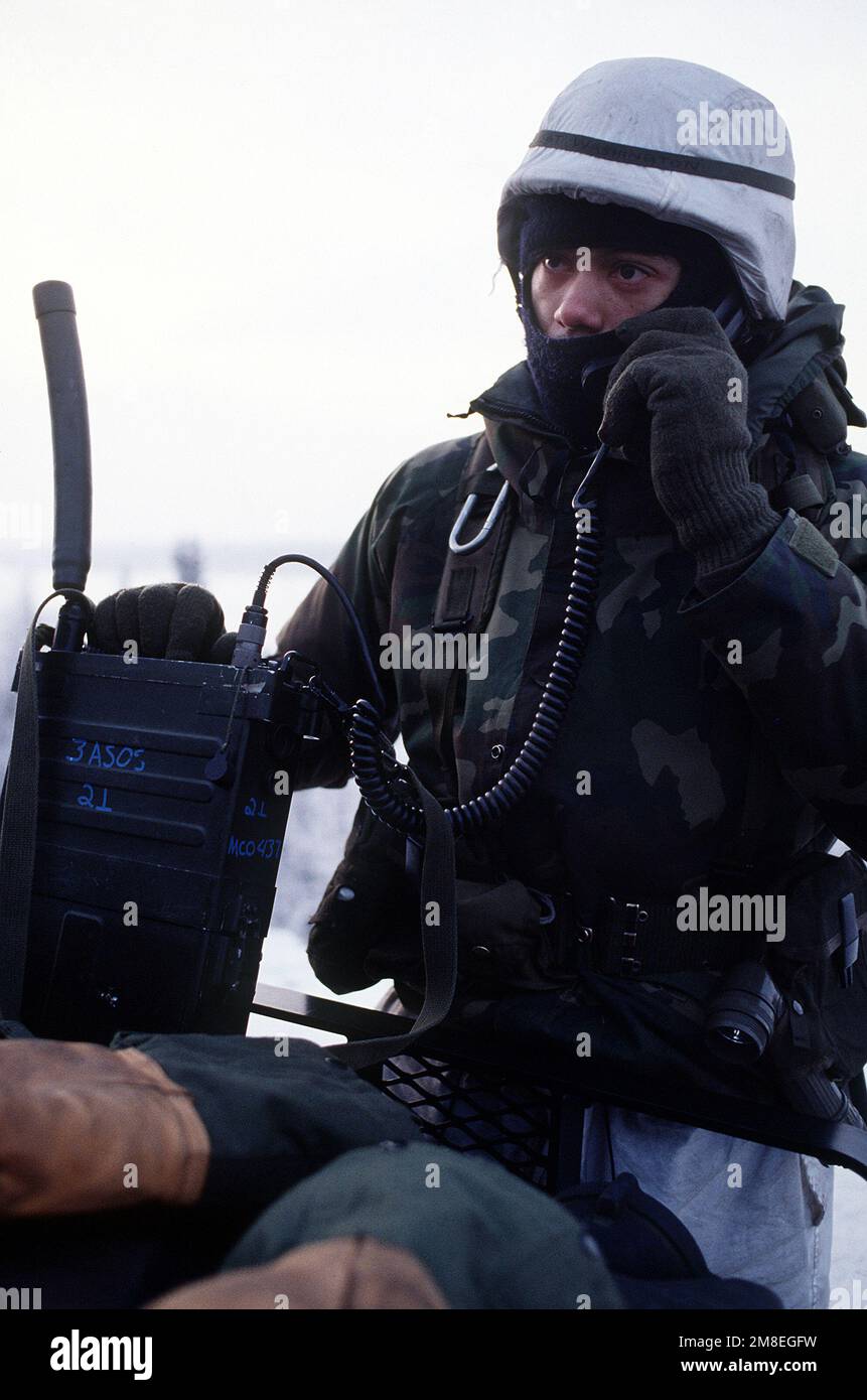 A forward air controller (FAC) relays target data to the pilot of an ...