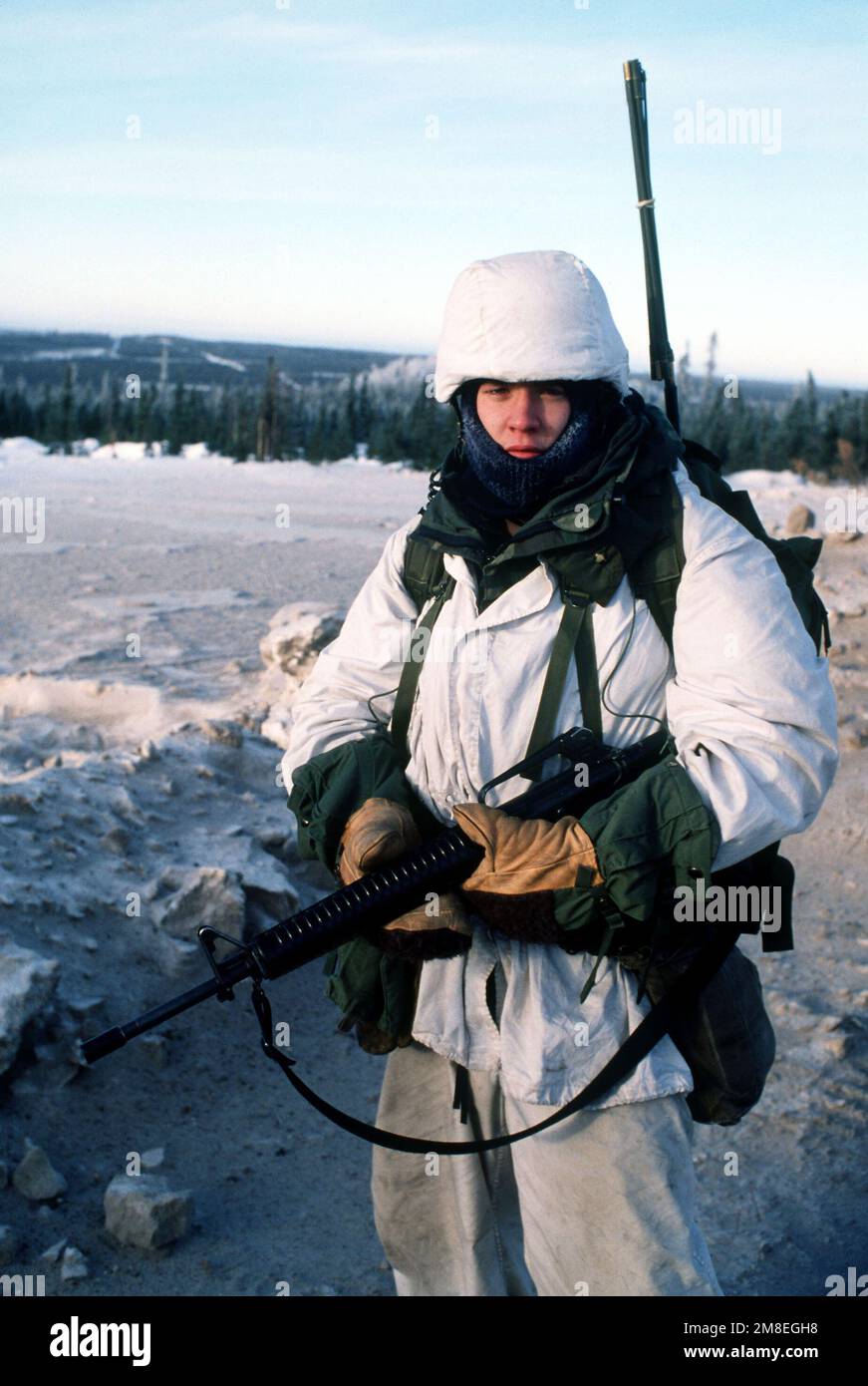 PFC James Teel, an artillery forward observer, pauses at the side of a ...