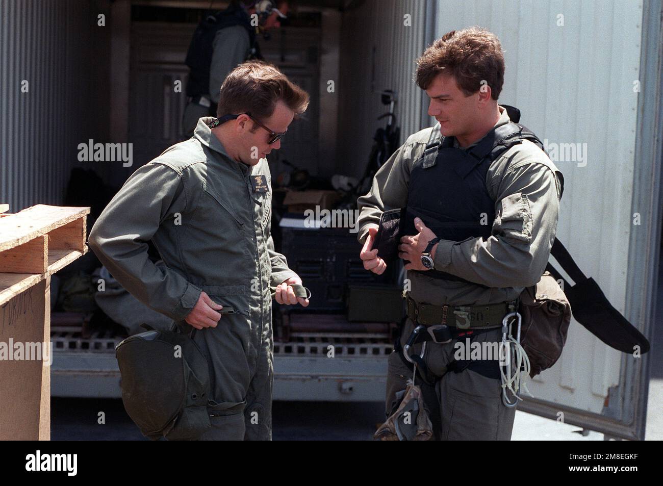 Members of Sea-Air-Land (SEAL) Team 8 prepare for a training exercise ...