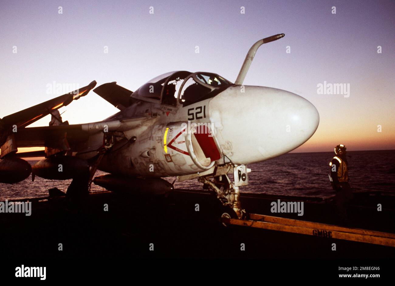 Flight deck crewmen prepare to move an Attack Squadron 35 (VA-35) KA-6D ...
