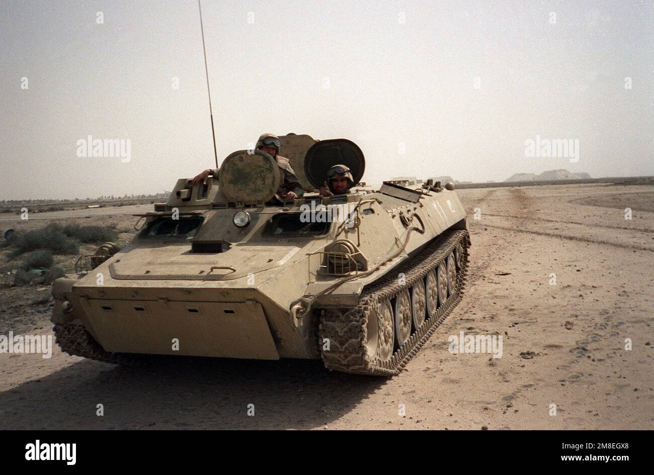 Members of the 1ST Marine Expeditionary Force (1ST MEF) ride in an ...