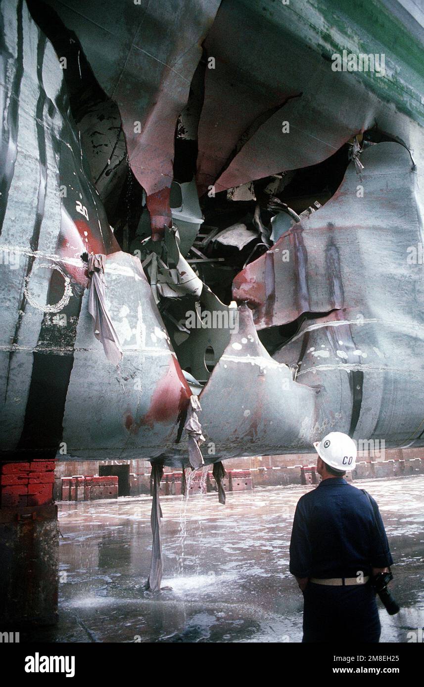 CAPT. G.B. McEwen, left, commanding officer of the amphibious assault ...