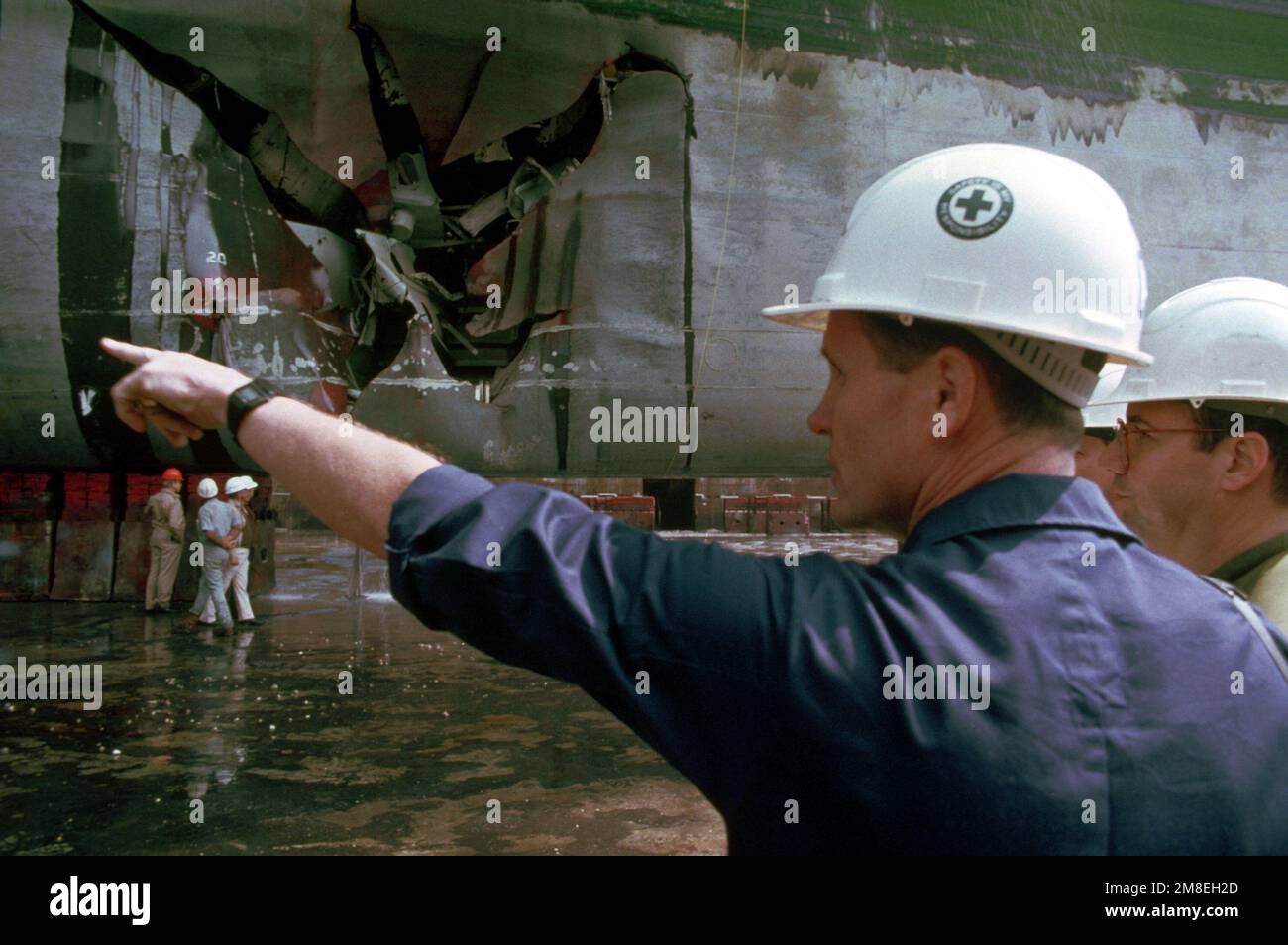 CAPT. G.B. McEwen, left, commanding officer of the amphibious assault ...