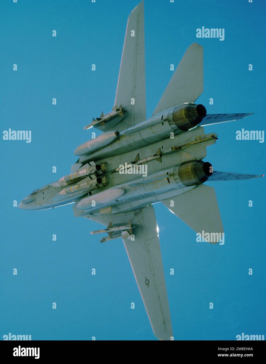 A view of the underside of a Fighter Squadron 33 (VF-33) F-14A Tomcat ...