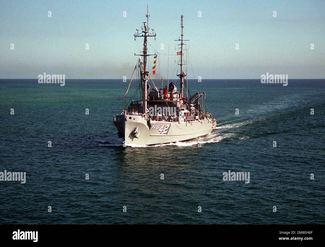 A port bow view of the salvage ship USS RECLAIMER (ARS-42) as it heads ...