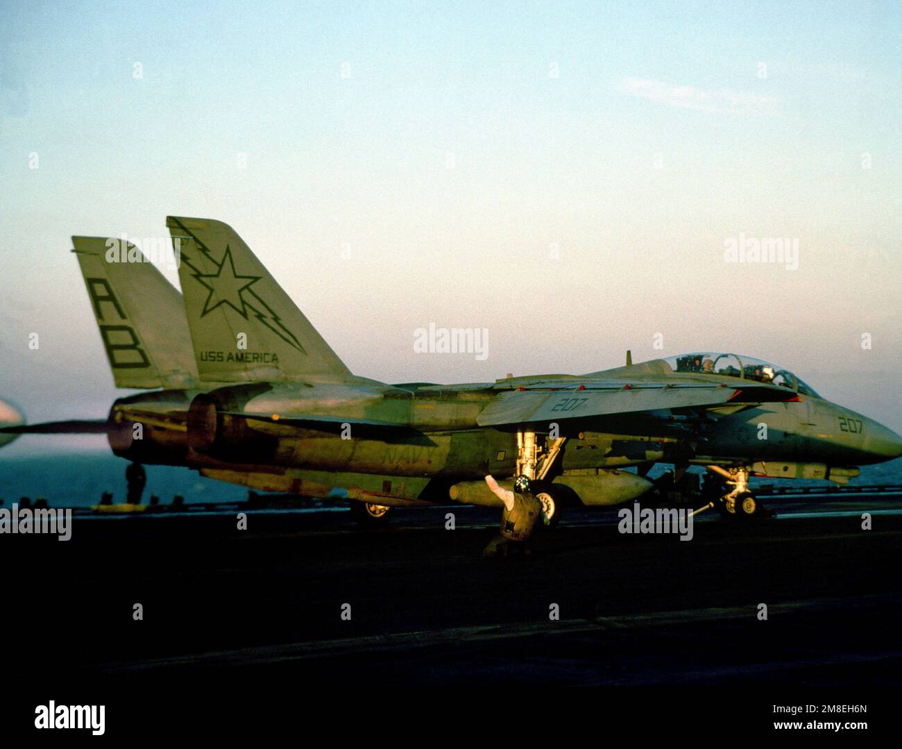 A Fighter Squadron 33 (VF-33) F-14A Tomcat aircraft stands by for ...