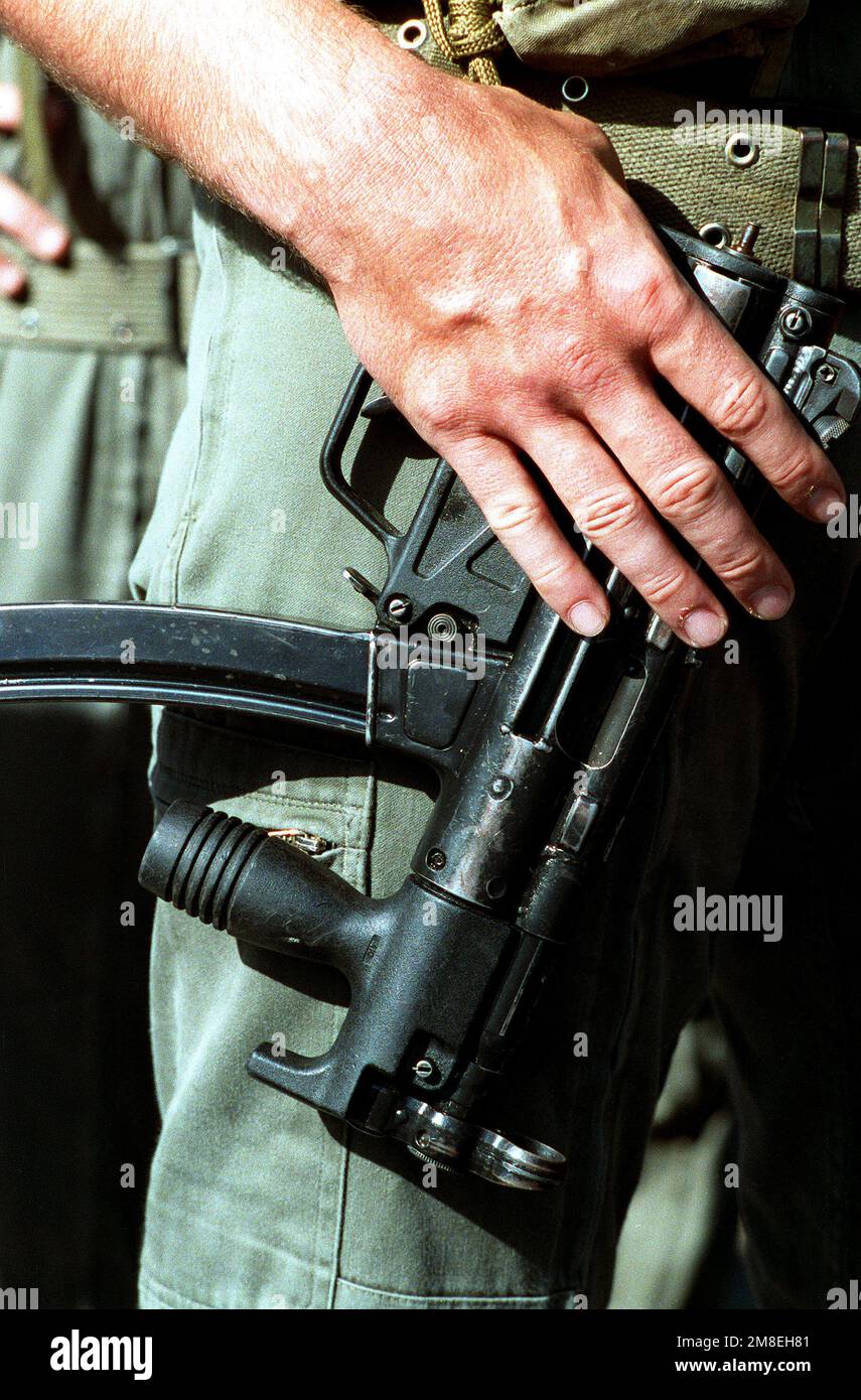 A close-up view of the MP-5K submachine gun carried by a boarding team ...