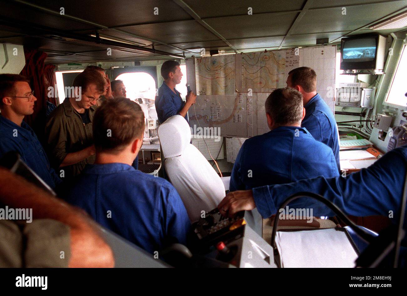 Officers gather on the bridge of the French destroyer FS Jean de Vienne ...