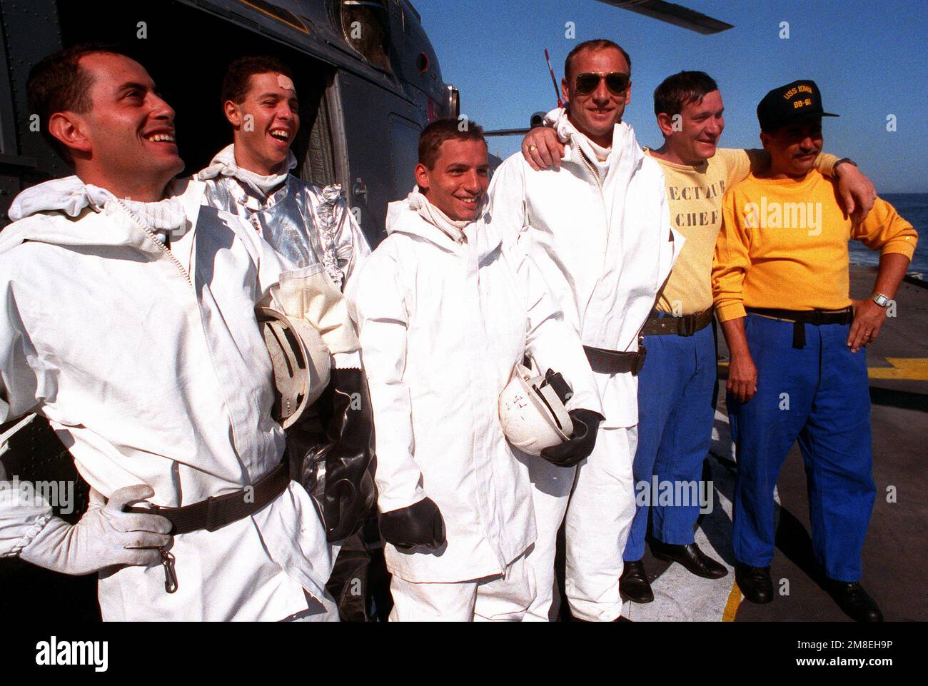 Members of the ship's helicopter crash crew gather for a group ...