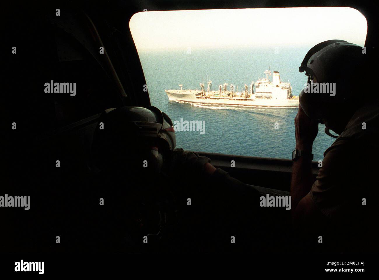CAPT. Douglas C. Bauer, right, a U.S. Navy historian, takes a ...