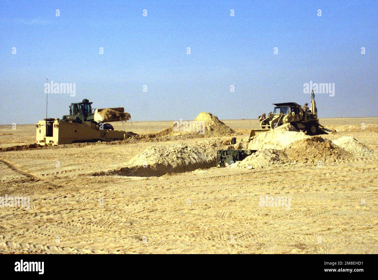 Marines from the 2nd Combat Engineer Battalion use a small emplacement ...