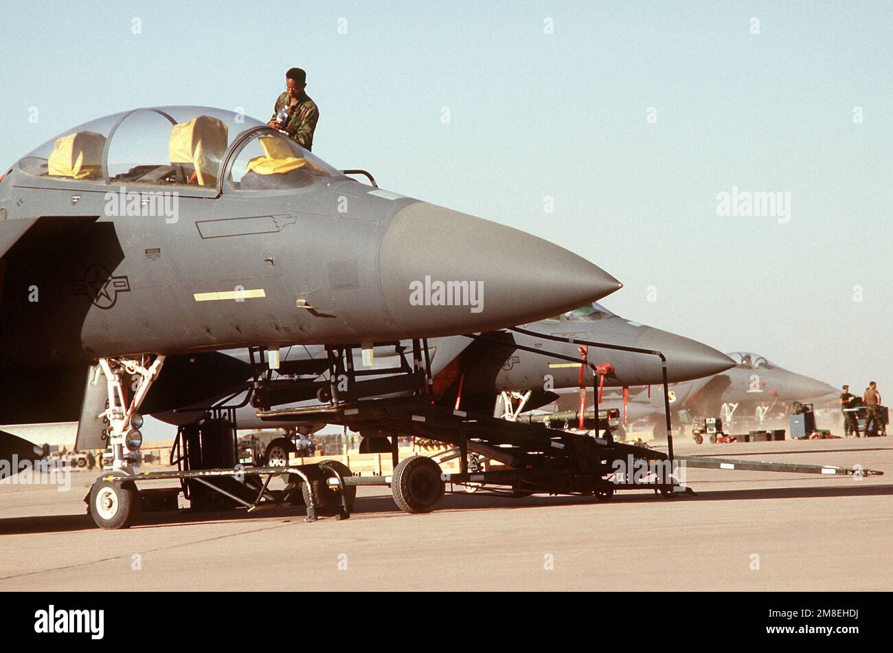 A ground crew member cleans the canopy of a 4th Tactical Fighter Wing F ...