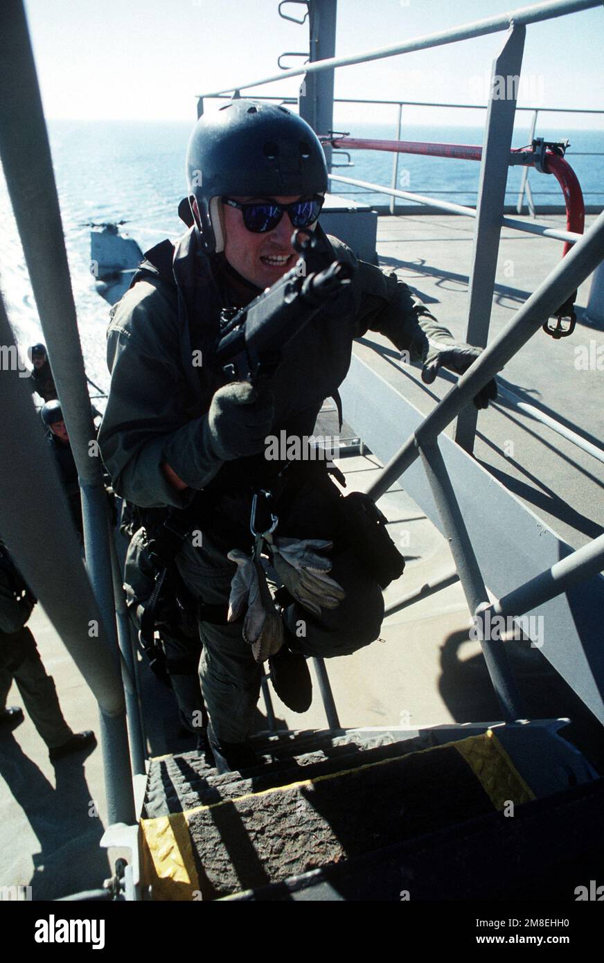 Armed with MP-5A5E 9mm submachine gun, a member of Sea-Air-Land (SEAL ...