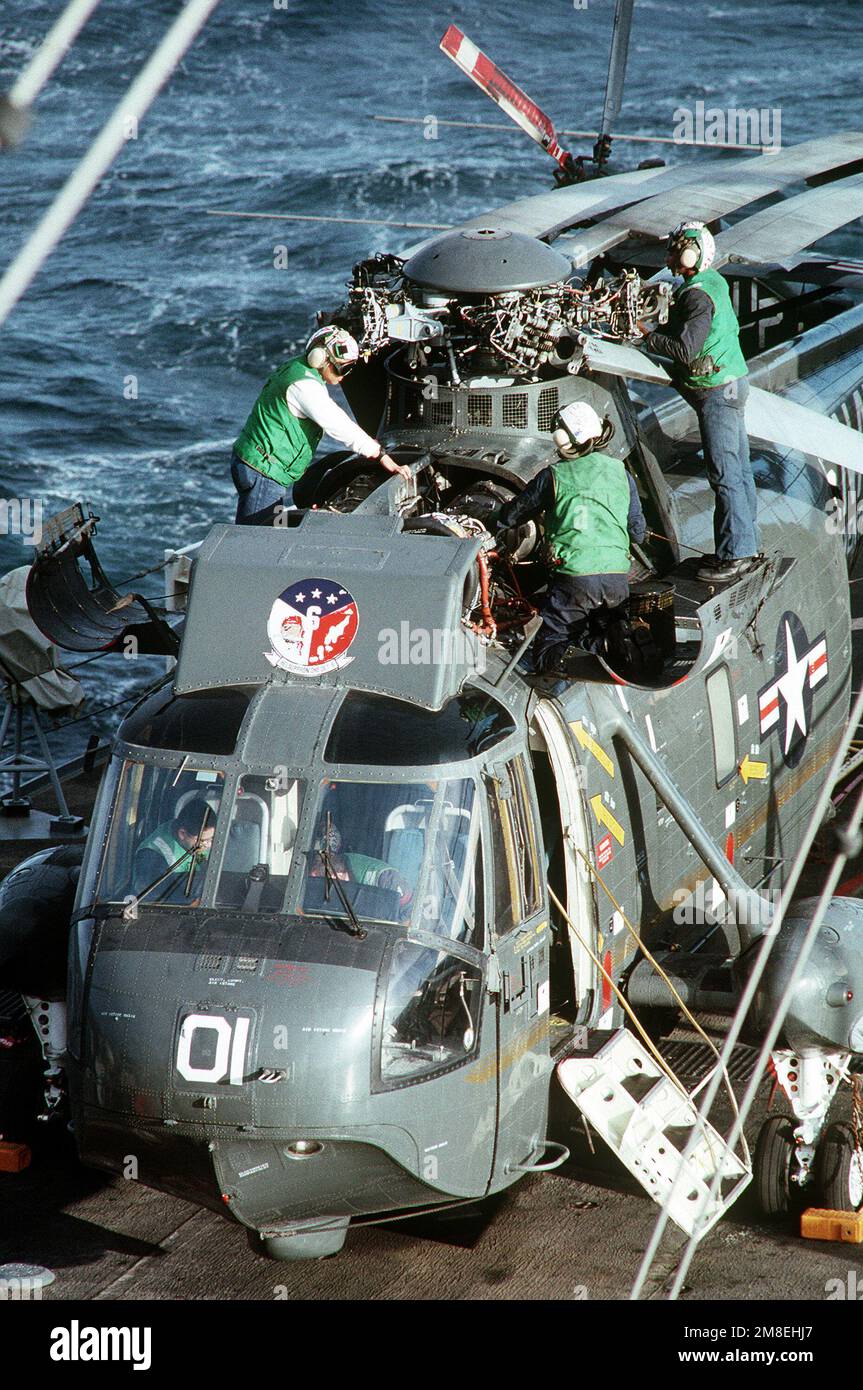 Maintenance crewmen work on a Helicopter Combat Support Squadron 1 (HC ...