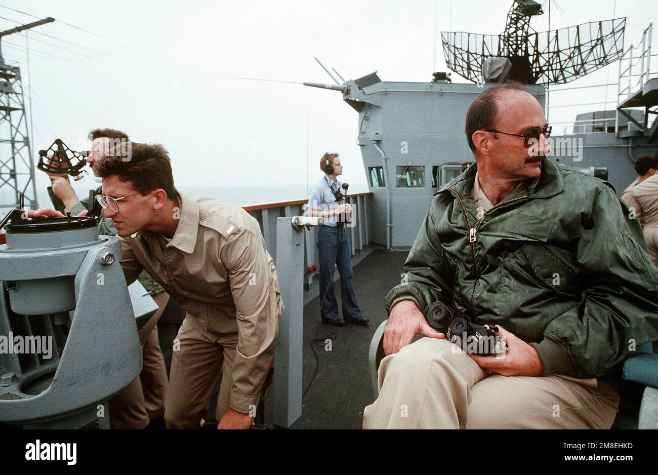 Two officers from the navigation department aboard the amphibious ...