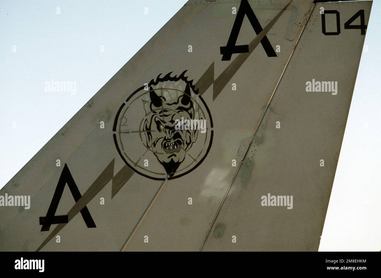 A view of the squadron insignia on the tail of a Fighter Squadron 74 ...