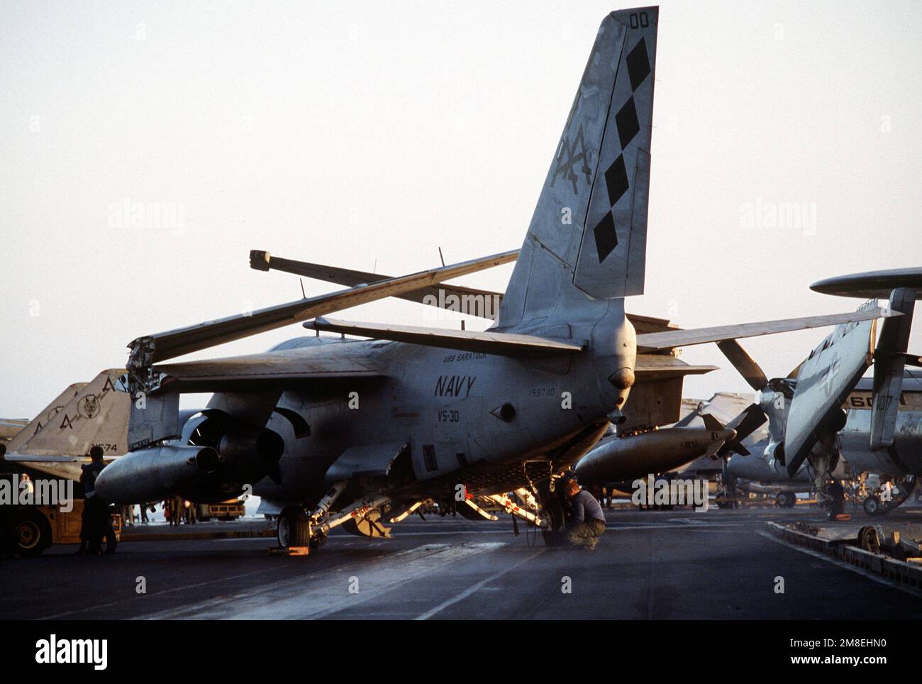 Aircraft handlers stand by to move an Air Anti-submarine Squadron 30 ...
