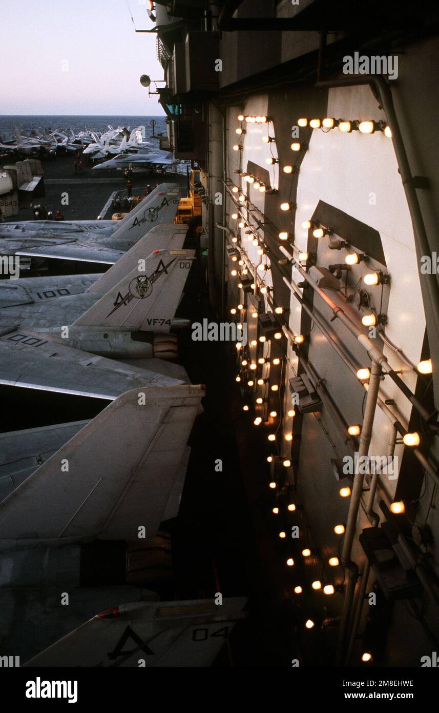 Three Fighter Squadron 74 (VF-74) F-14A Tomcat aircraft sit on the ...
