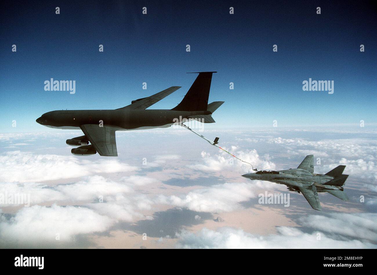 A Fighter Squadron 32 (VF-32) F-14A Tomcat aircraft is refueled by a U ...